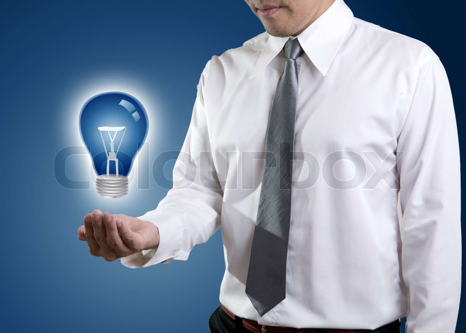 Light bulb in hand | Stock image | Colourbox