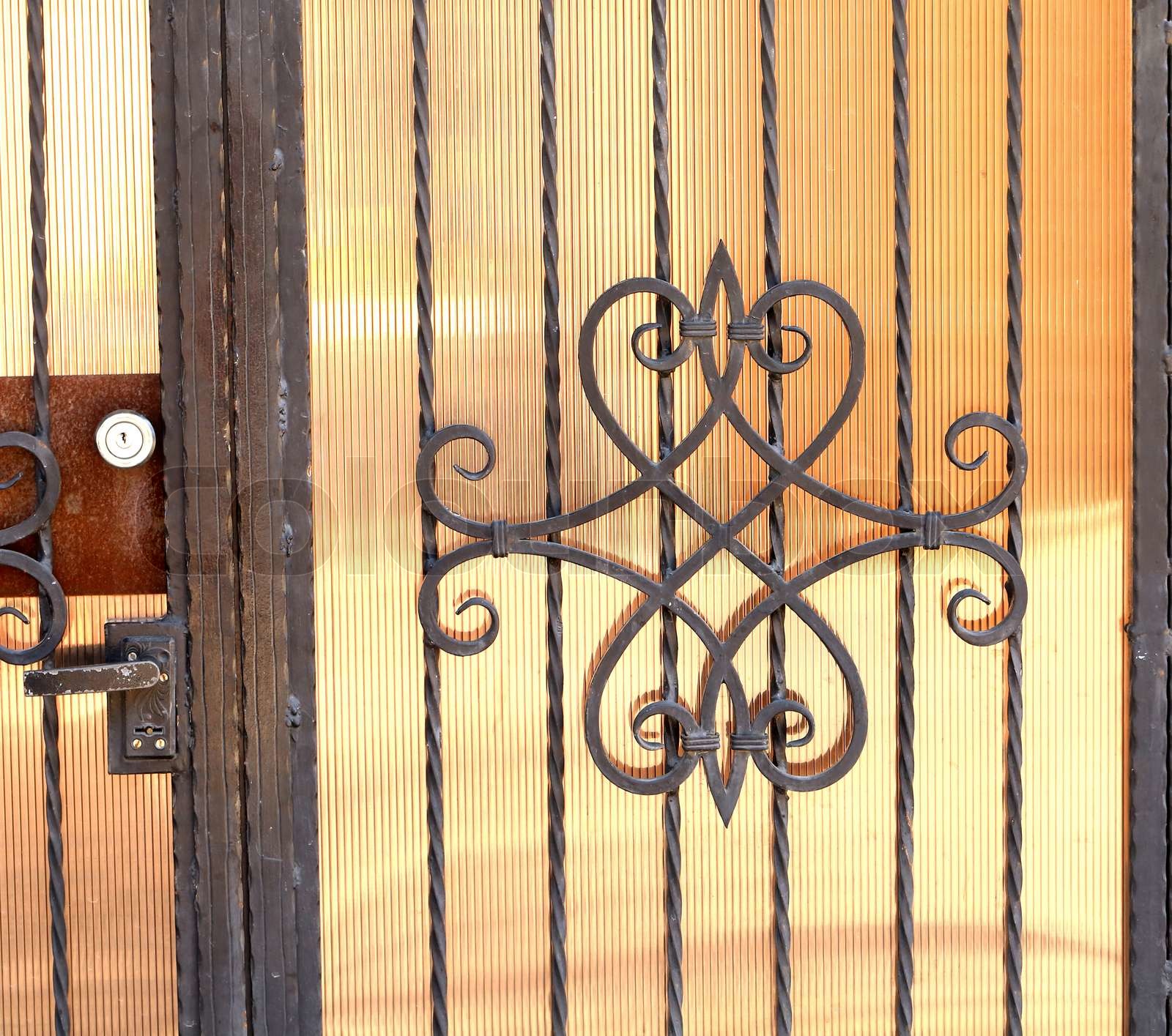 Wicket gate of hammered metal | Stock image | Colourbox