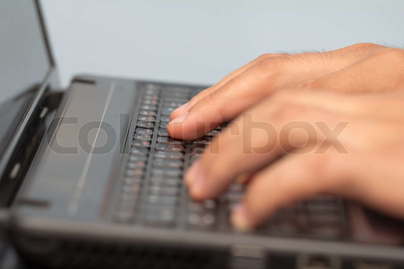 Work with your fingers on the keyboard on a laptop | Stock image ...
