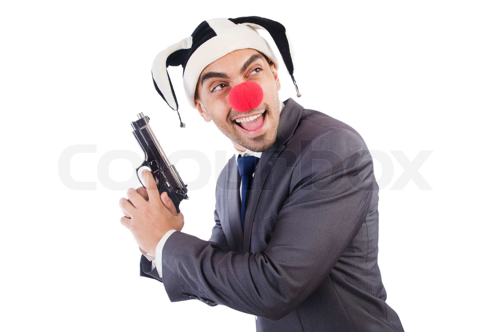 Businessman clown with gun isolated on white | Stock image | Colourbox