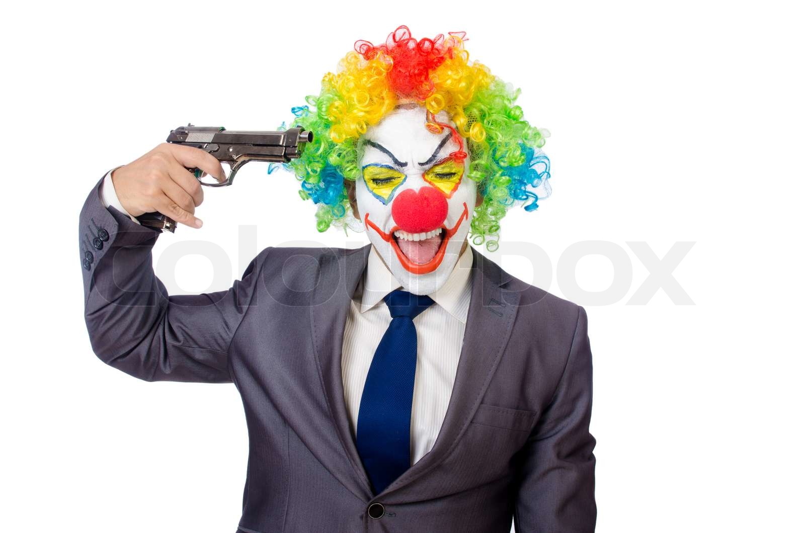Businessman clown with gun isolated on white | Stock image | Colourbox