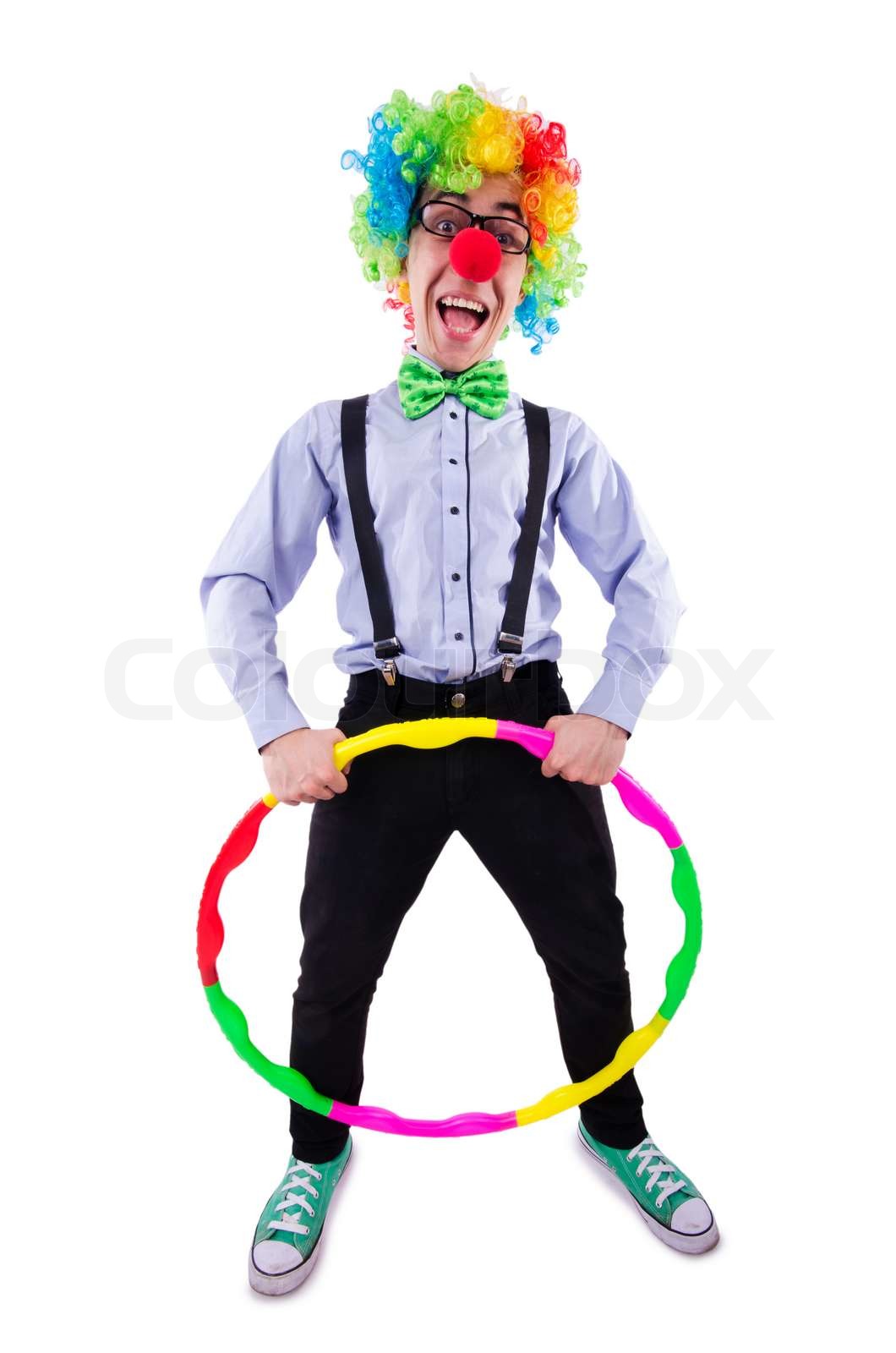 Funny clown with hula hoop on white | Stock image | Colourbox