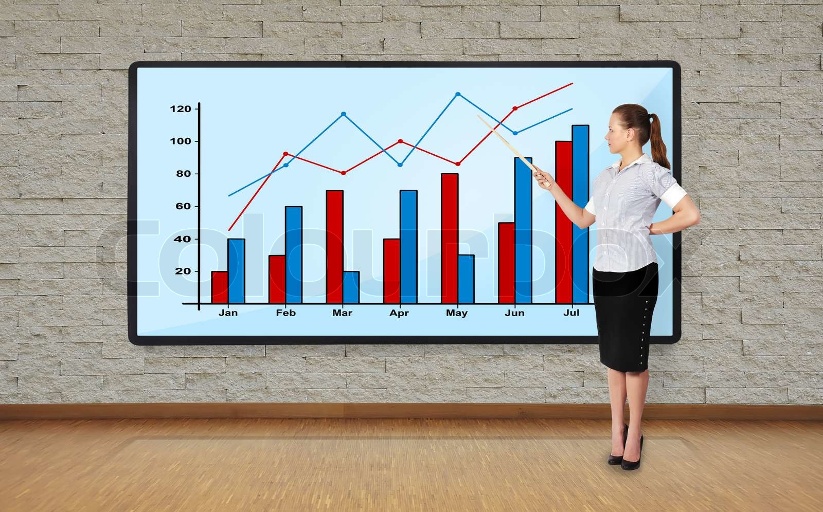 woman pointing at graph | Stock image | Colourbox