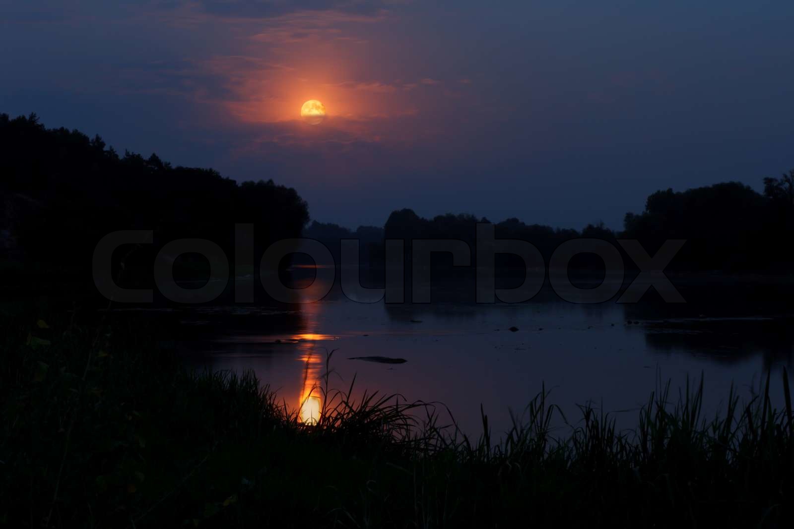 The full moon rise over the river | Stock image | Colourbox