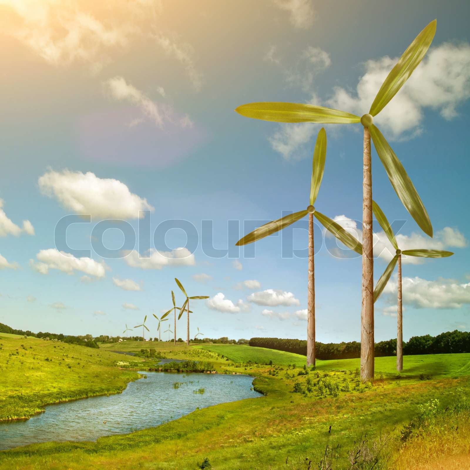 Green energy concept - natural wind generator turbines on summer ...