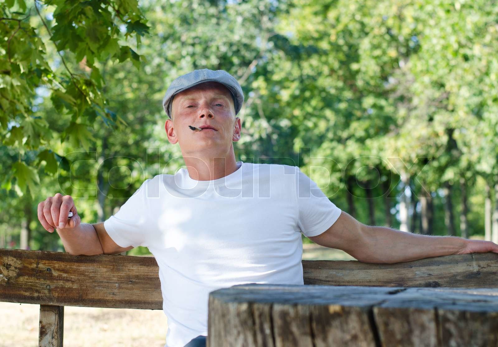 Man puffing on a cigarette | Stock image | Colourbox
