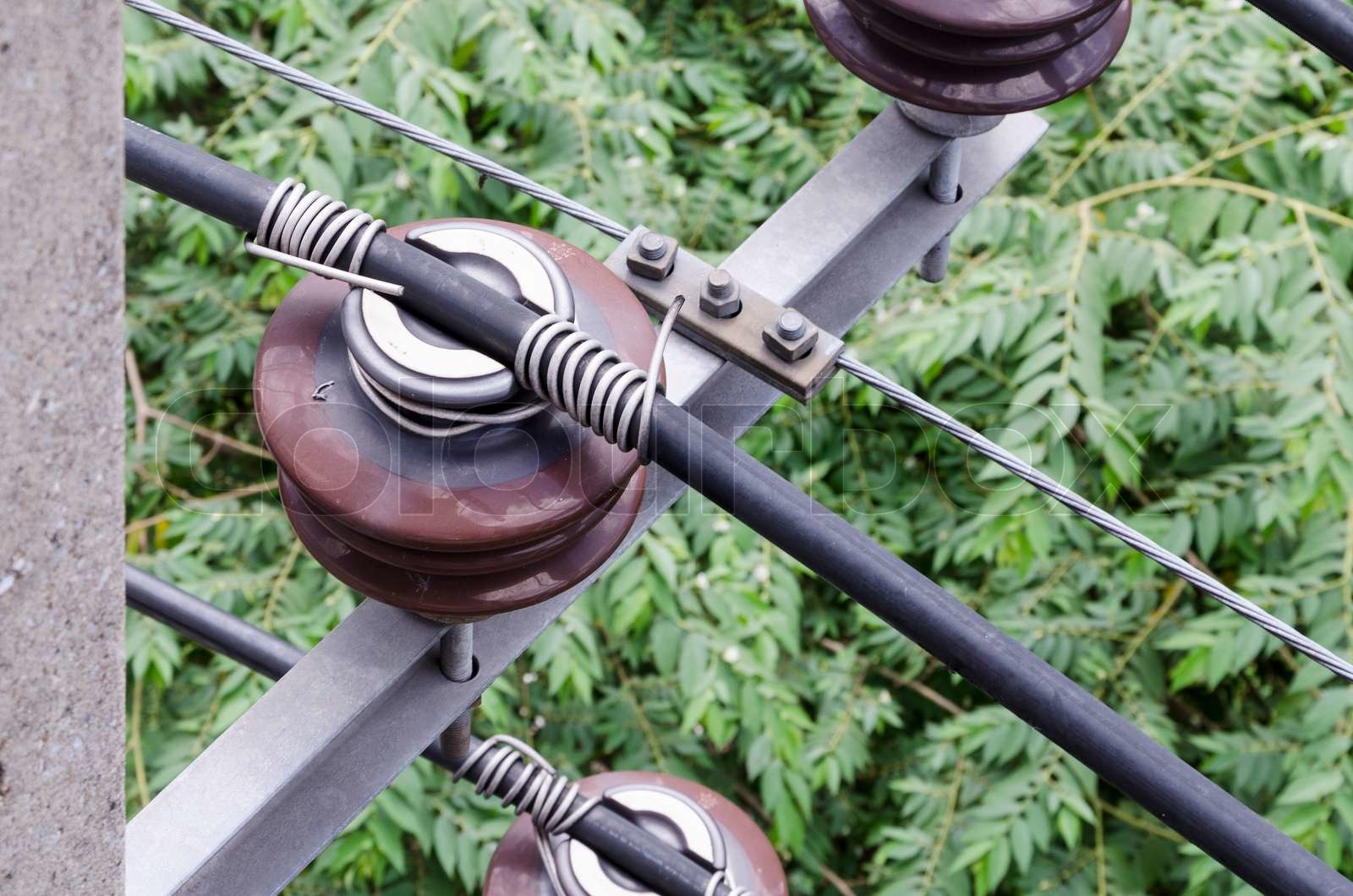 closed up electrical insulator on elecrical pole | Stock image | Colourbox