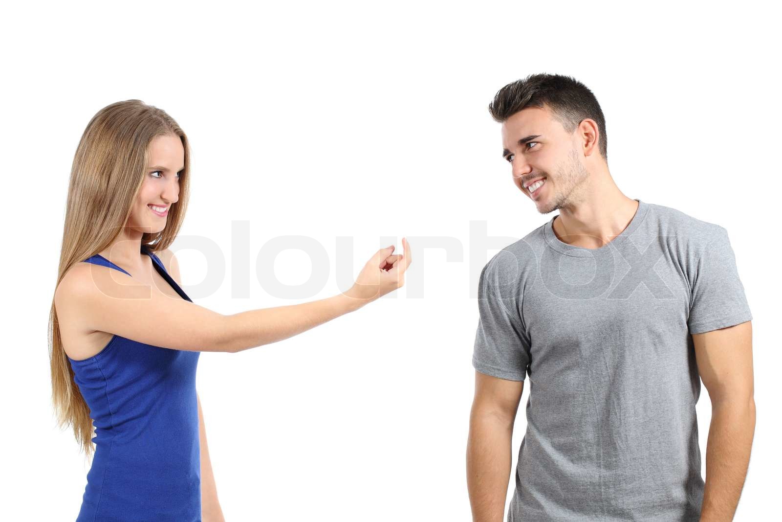 Woman gesturing beckoning to a man | Stock image | Colourbox