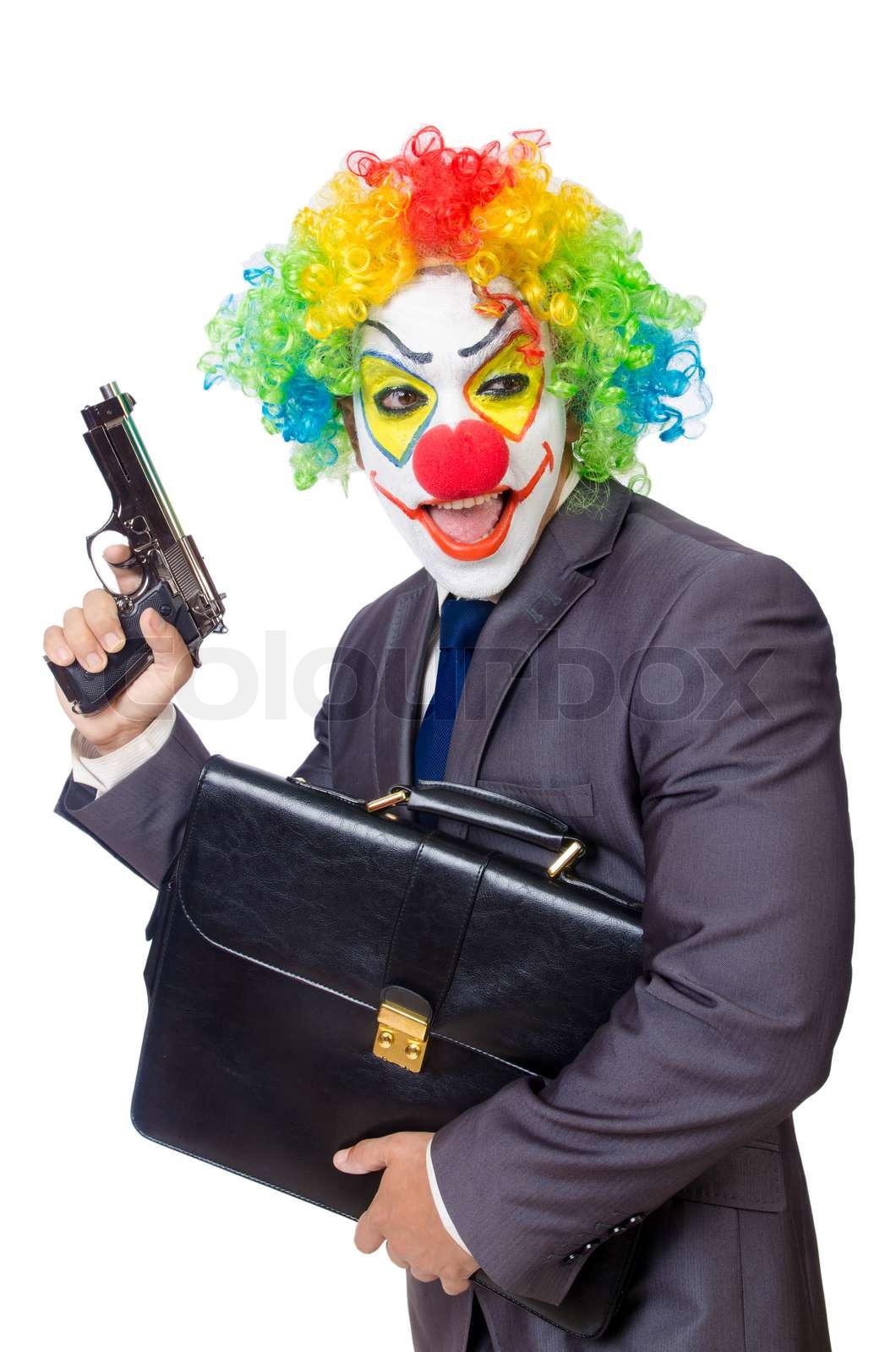Businessman clown with gun isolated on white | Stock image | Colourbox