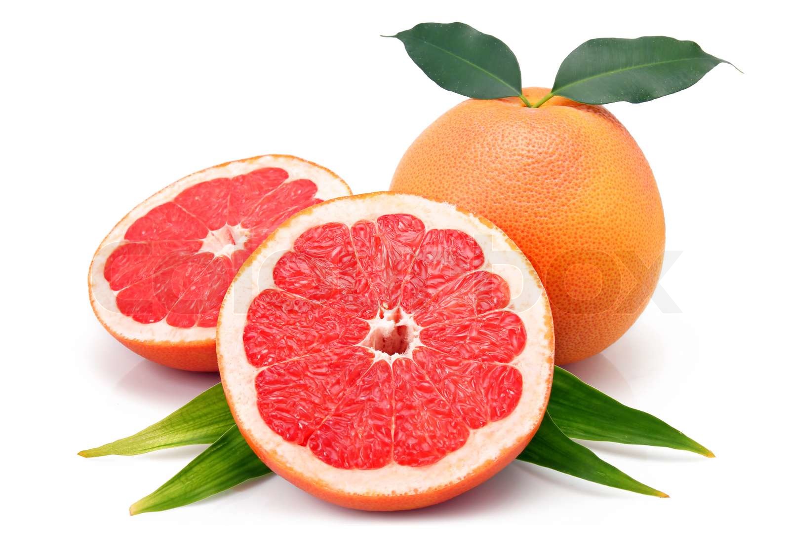 Grapefruit fruits with cuts and green leaf isolated | Stock image ...