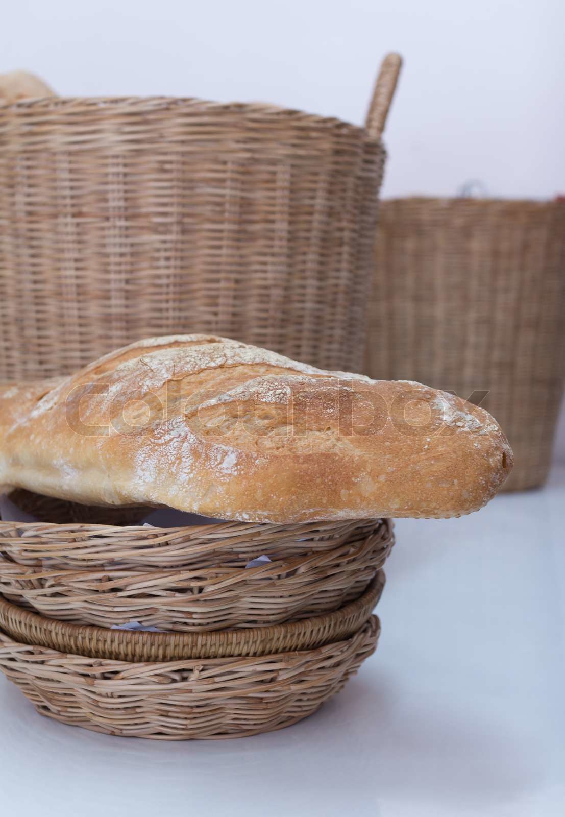 Bread baton in bamboo basket | Stock image | Colourbox