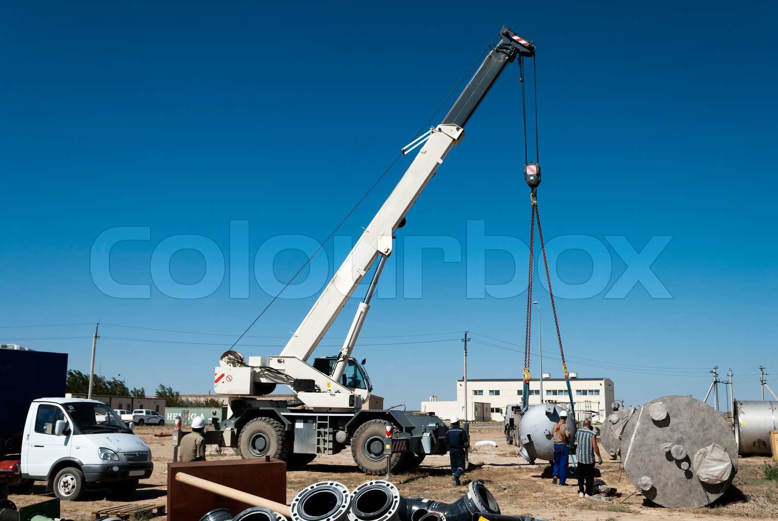 unloading by the crane of the production equipment | Stock image ...