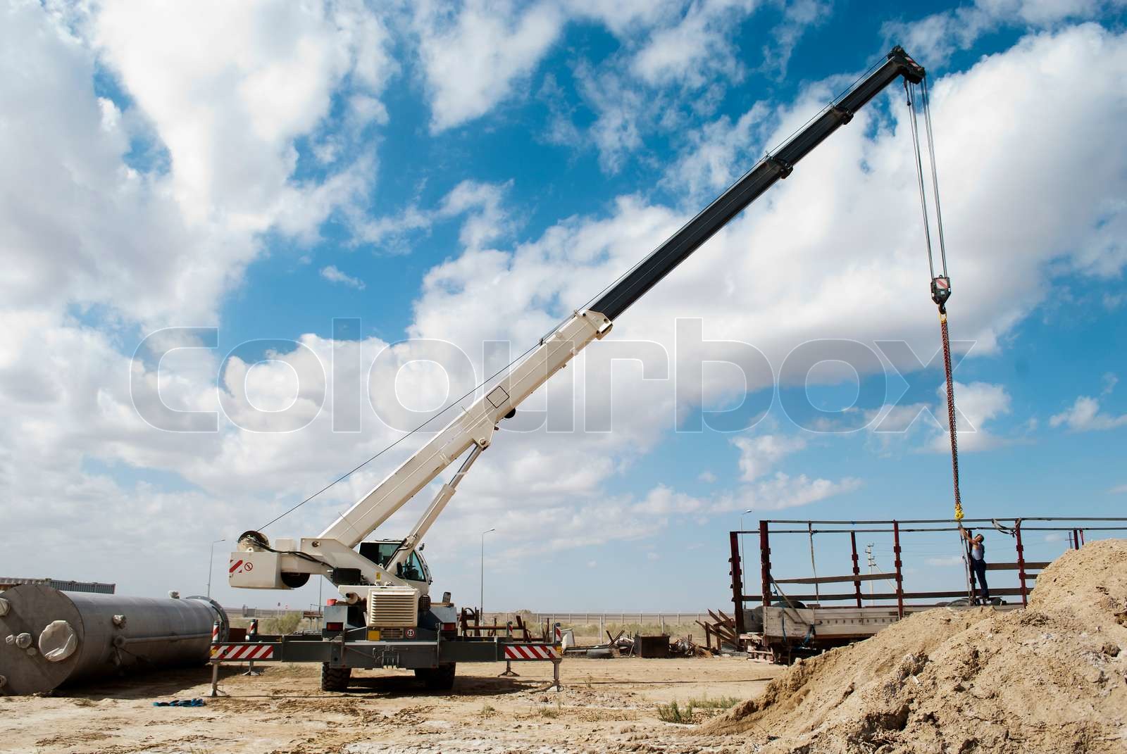 unloading by the crane of the production equipment | Stock image ...