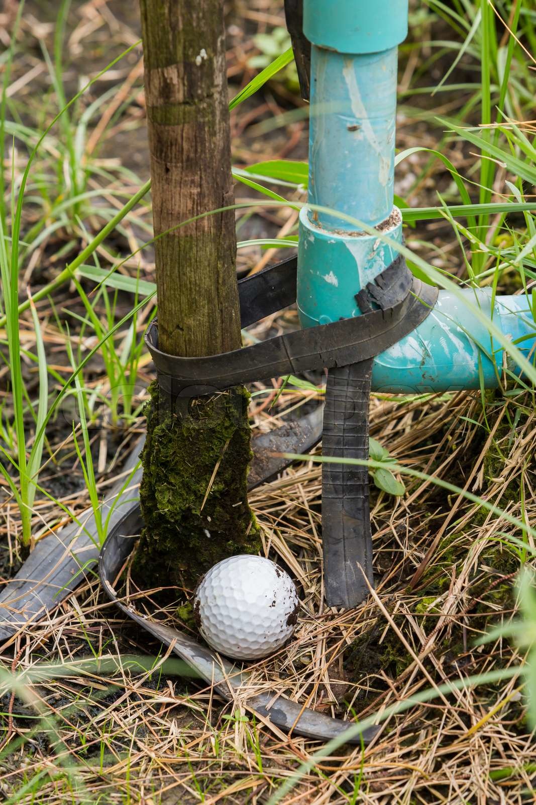 Golf ball near the tab water pipe | Stock image | Colourbox