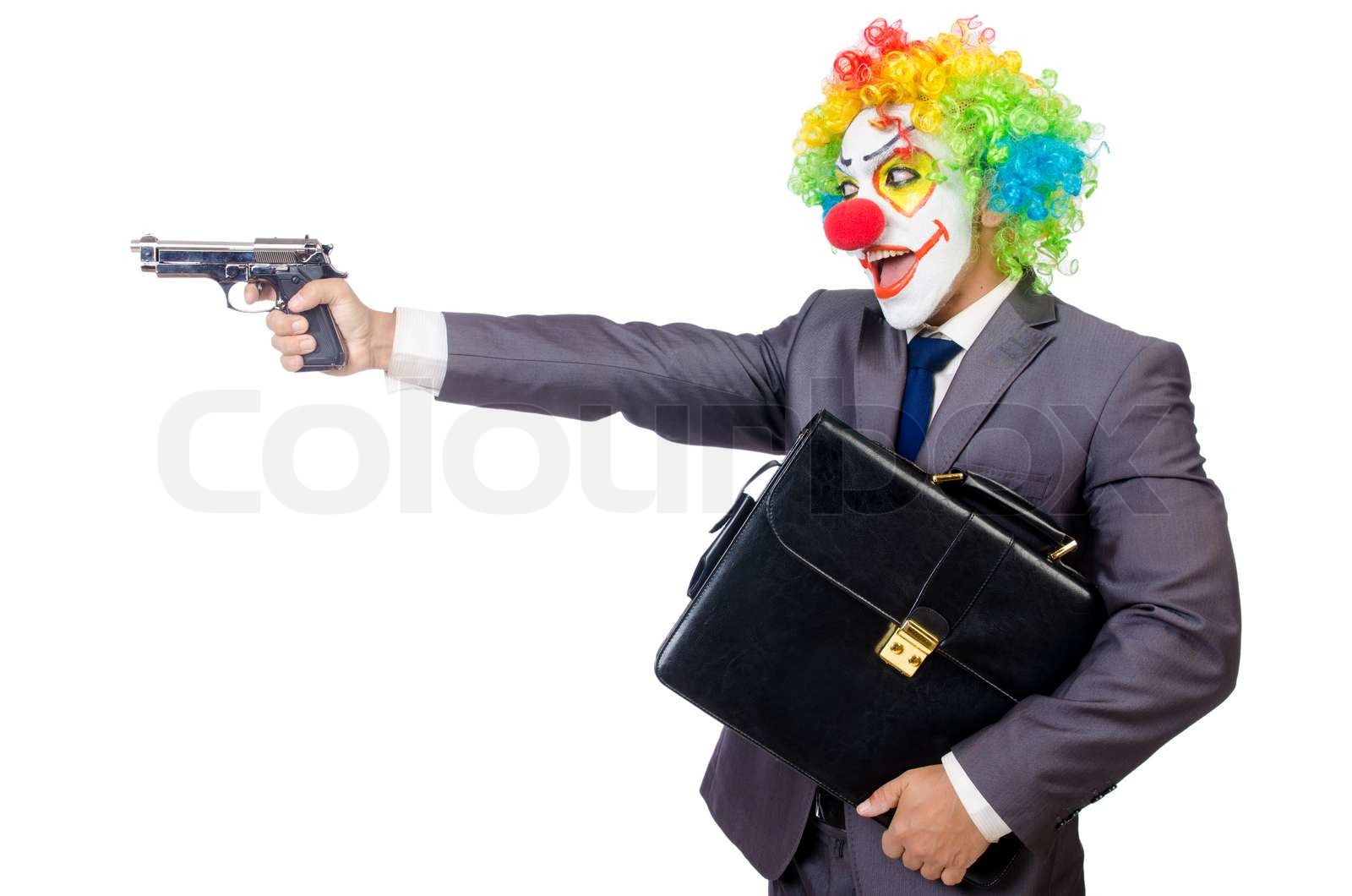 Businessman clown with gun isolated on white | Stock image | Colourbox