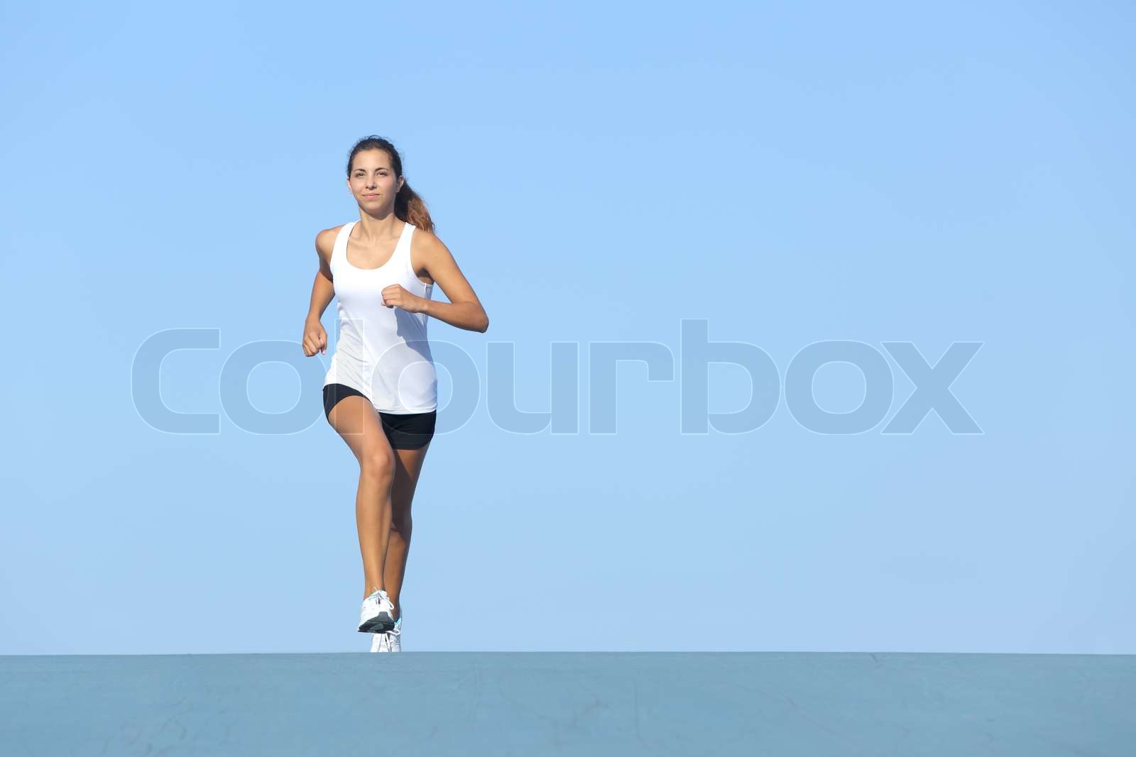 Runner woman running alone | Stock image | Colourbox