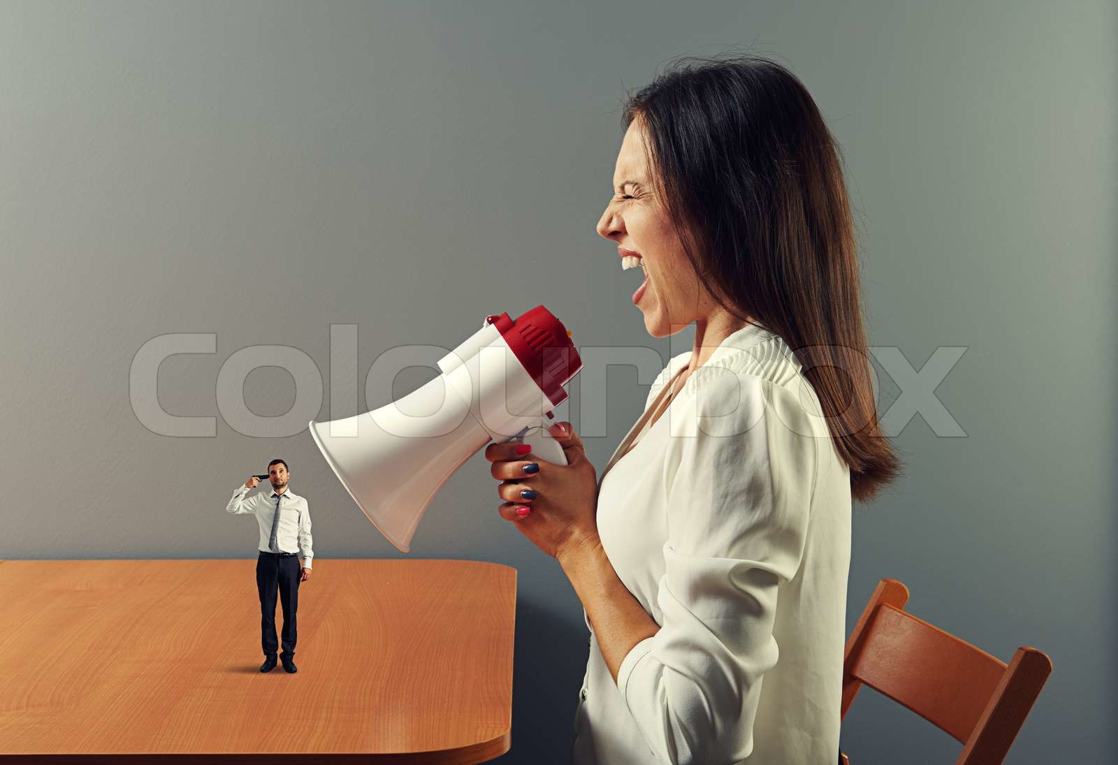 woman screaming at man with gun | Stock image | Colourbox