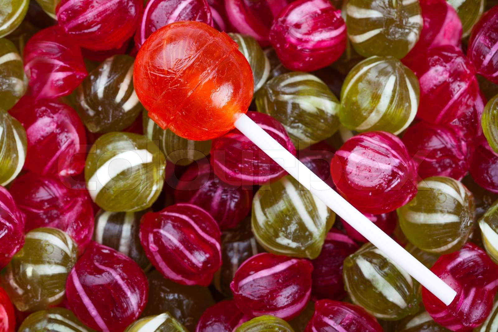 Lollipop on ball shaped candy | Stock image | Colourbox
