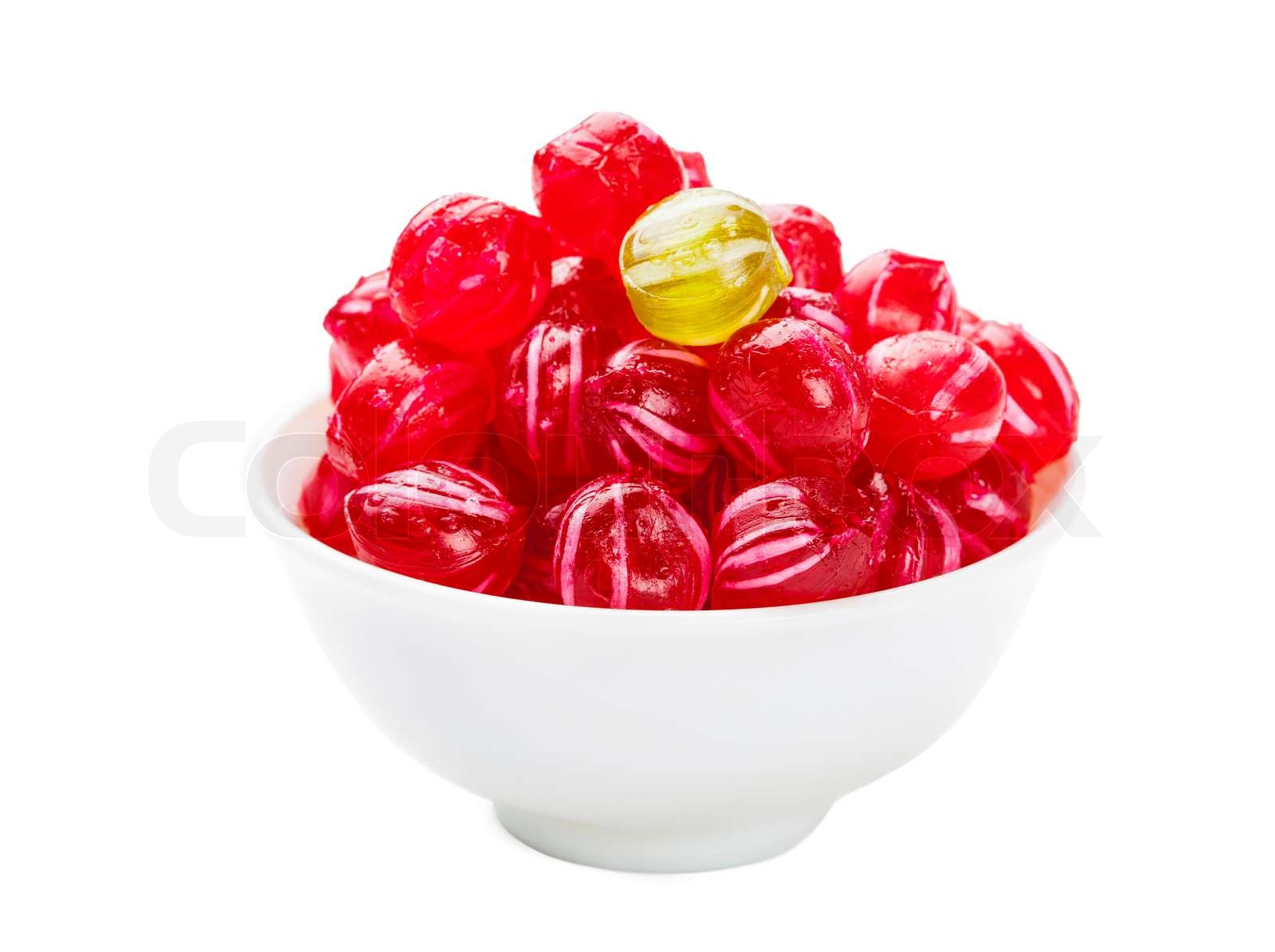 Ball shaped candy in bowl isolated on white | Stock image | Colourbox