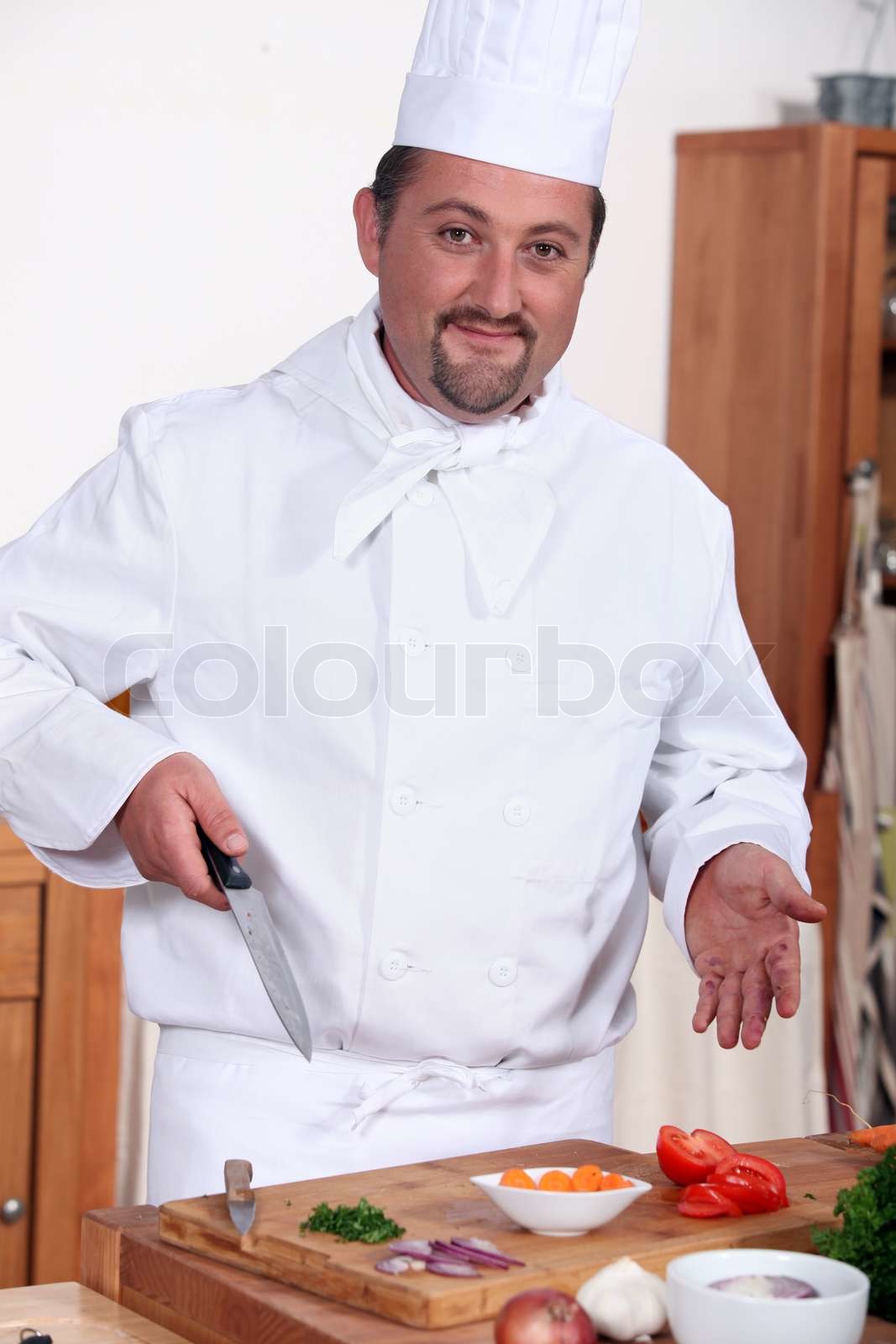 Chef preparing a meal | Stock image | Colourbox