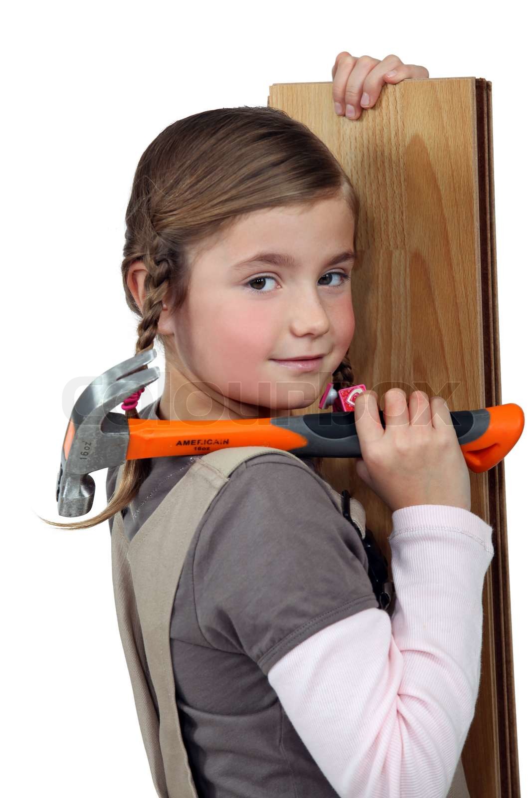 Girl with hammer | Stock image | Colourbox