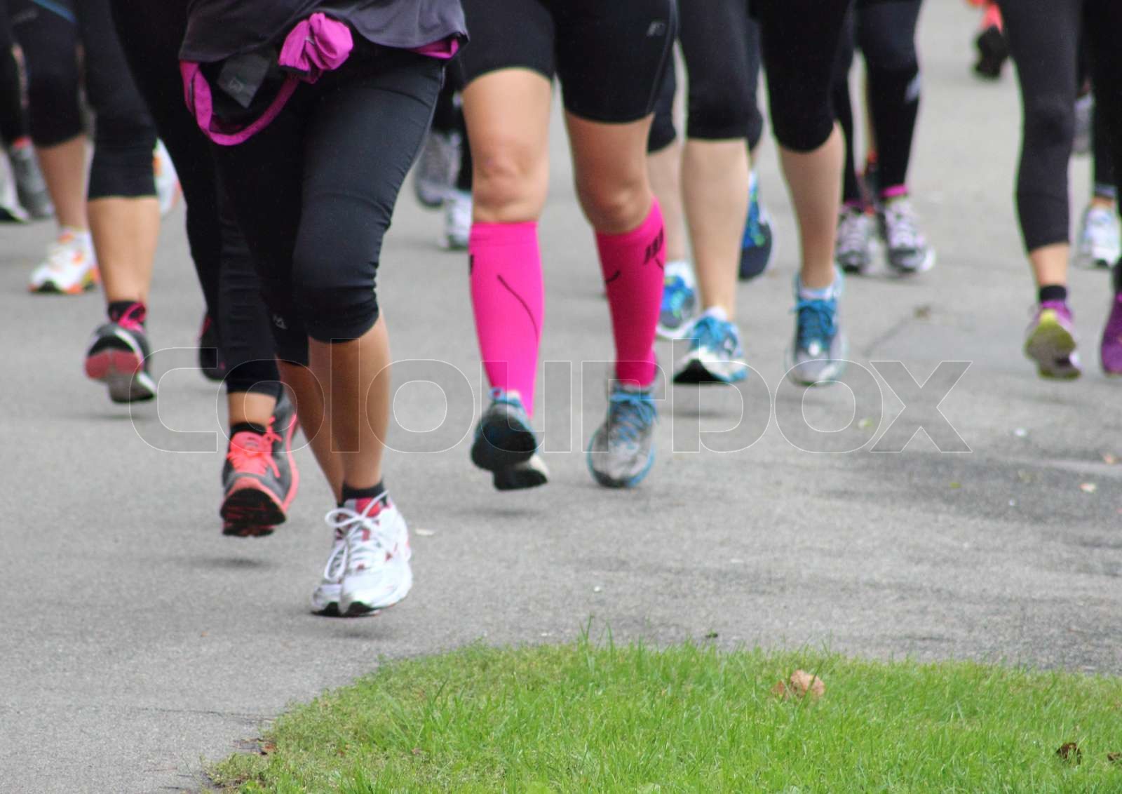 Running line of legs from a race | Stock image | Colourbox
