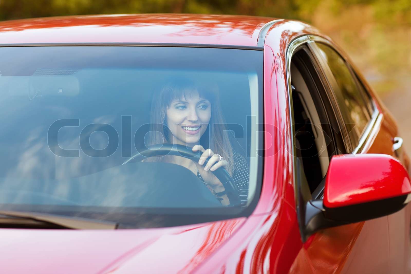 business woman riding in the car | Stock image | Colourbox