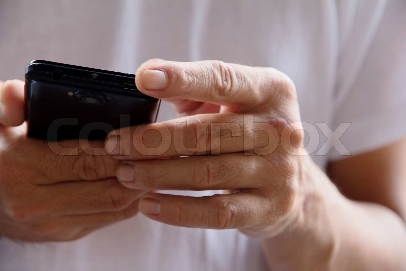 man checking his phone | Stock image | Colourbox