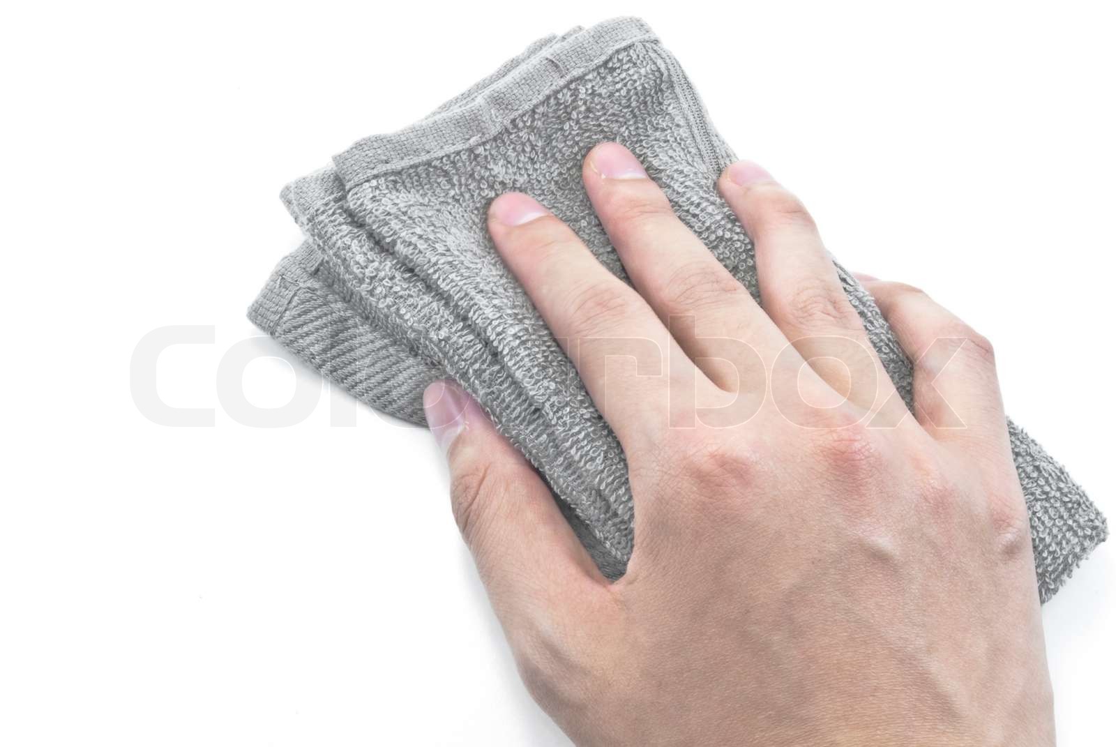 male hand wiping with grey rag | Stock image | Colourbox