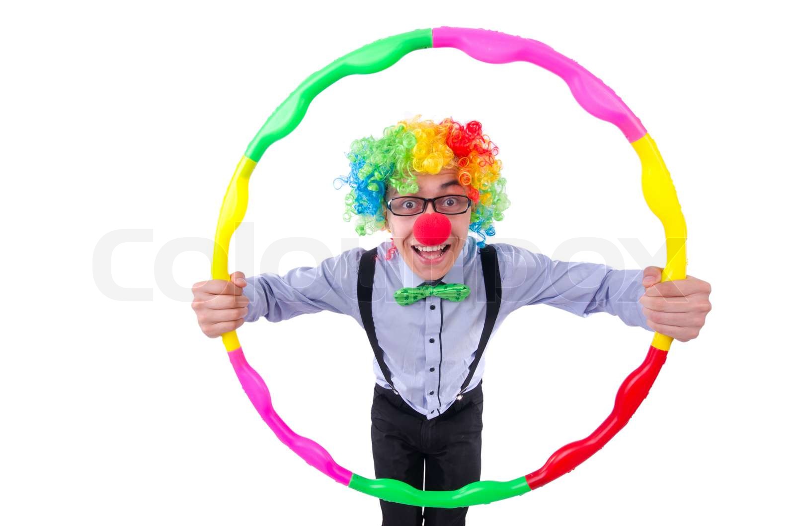 Funny clown with hula hoop on white | Stock image | Colourbox