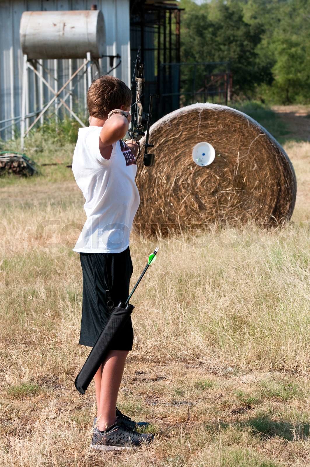 Teen boy bow hunting | Stock image | Colourbox