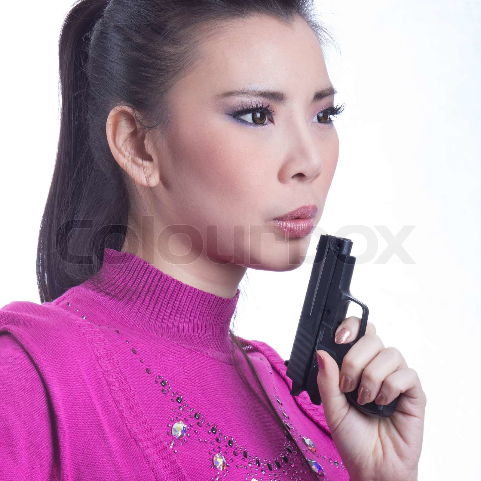 woman aiming a gun | Stock image | Colourbox