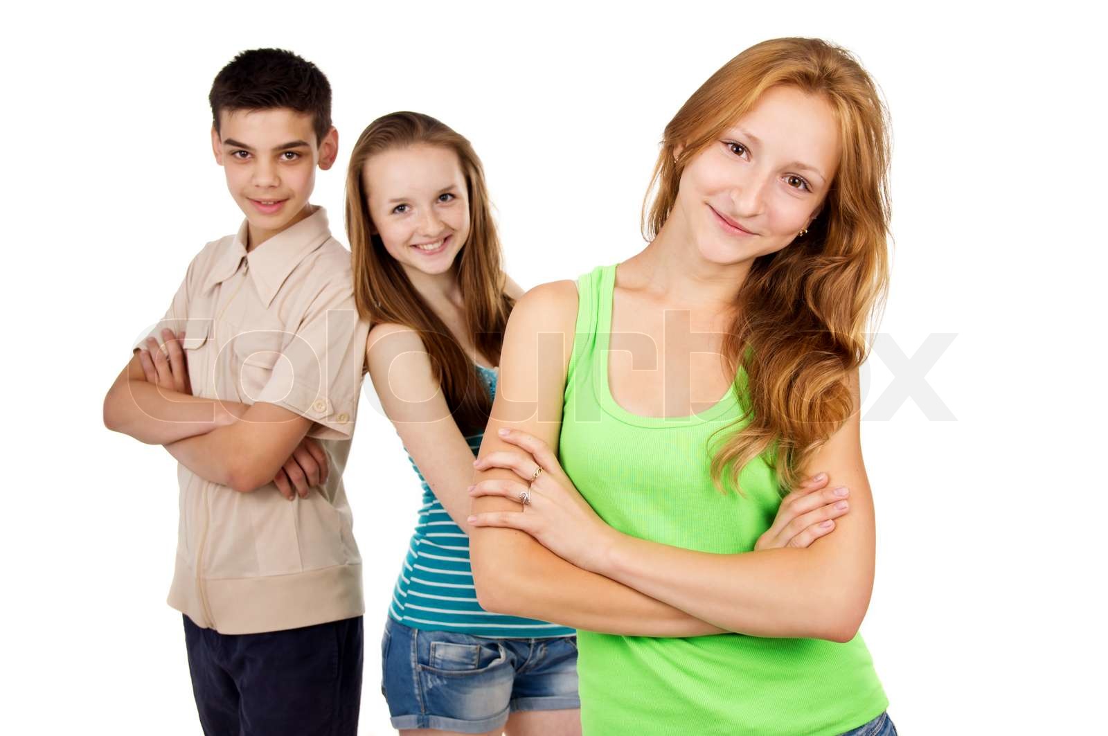 Ung pige på baggrund af venner | Stock foto | Colourbox