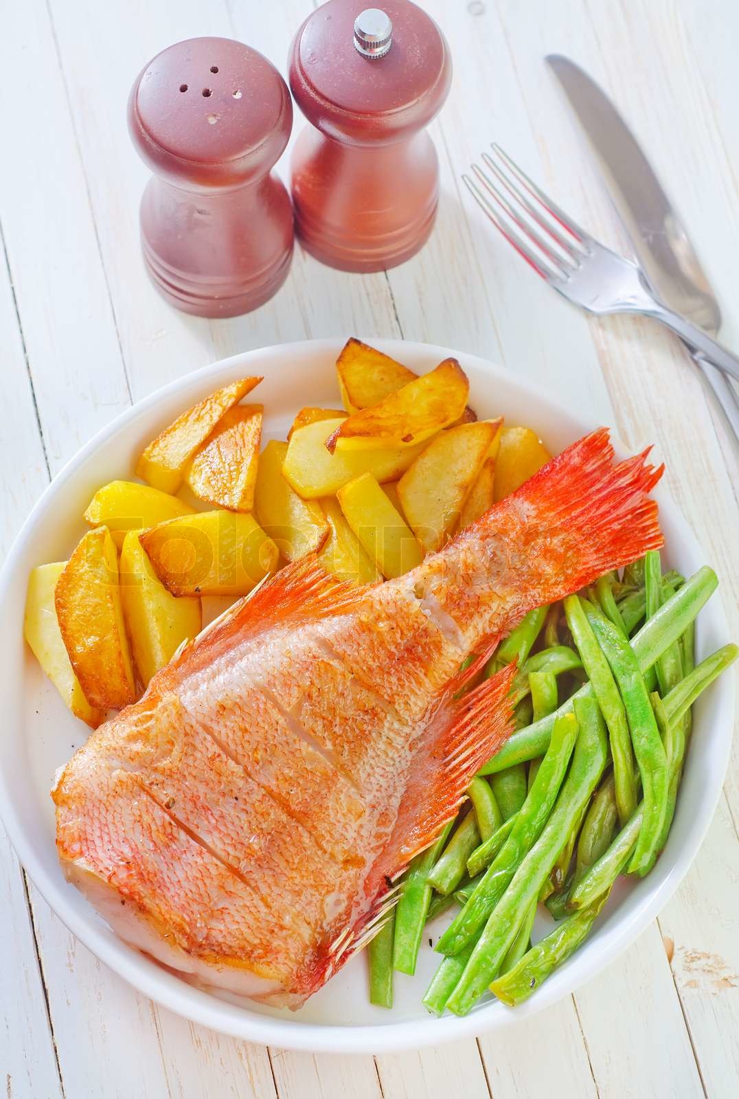 fried fish, potato and green beans | Stock image | Colourbox