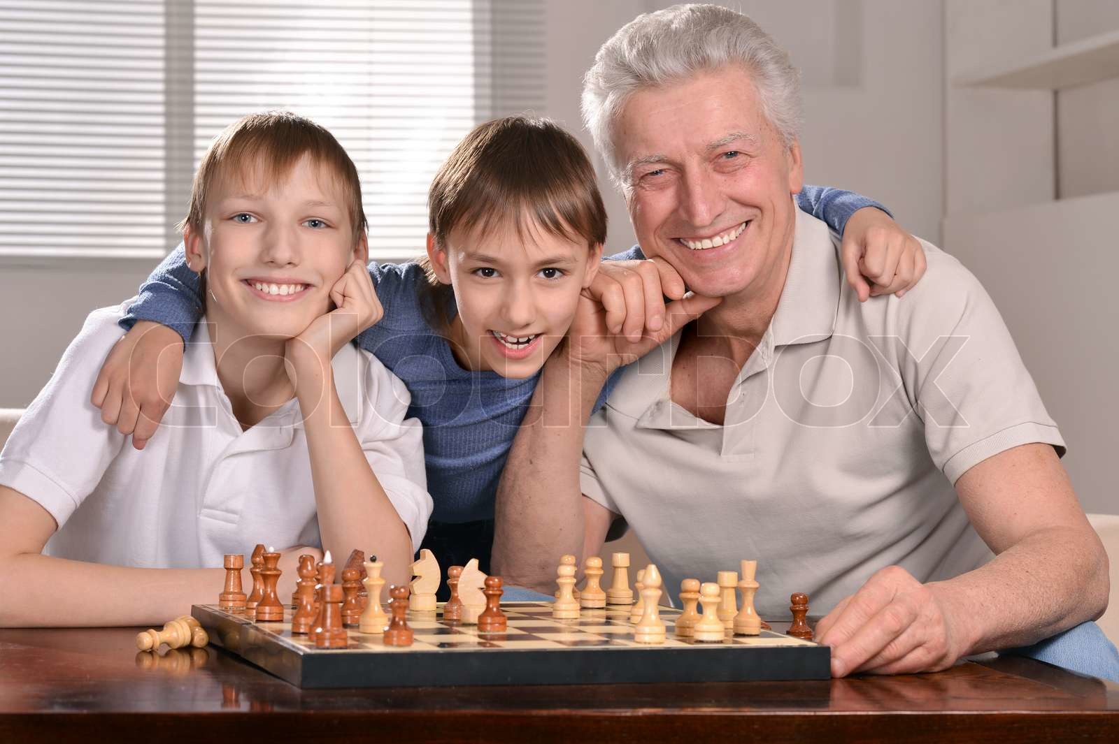 happy family at a chess | Stock image | Colourbox