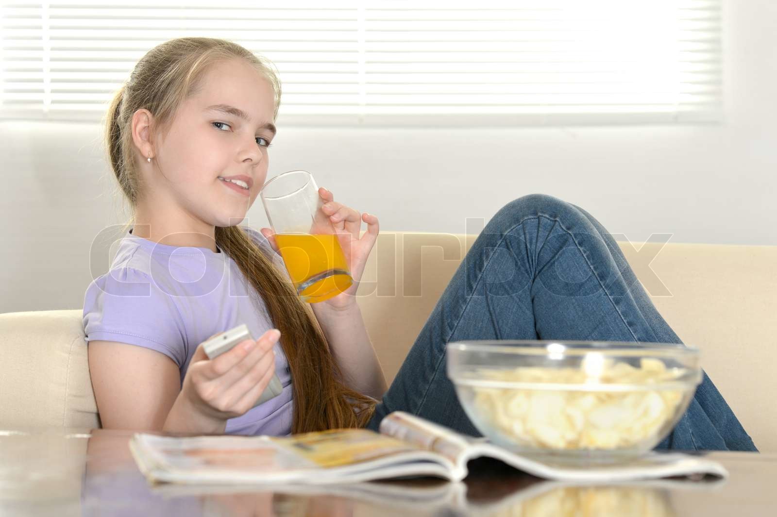 girl watching TV | Stock image | Colourbox