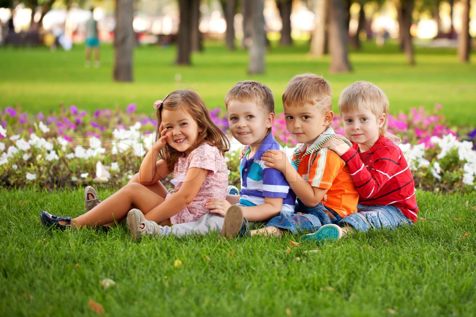Group of fun children on the green grass | Stock image | Colourbox