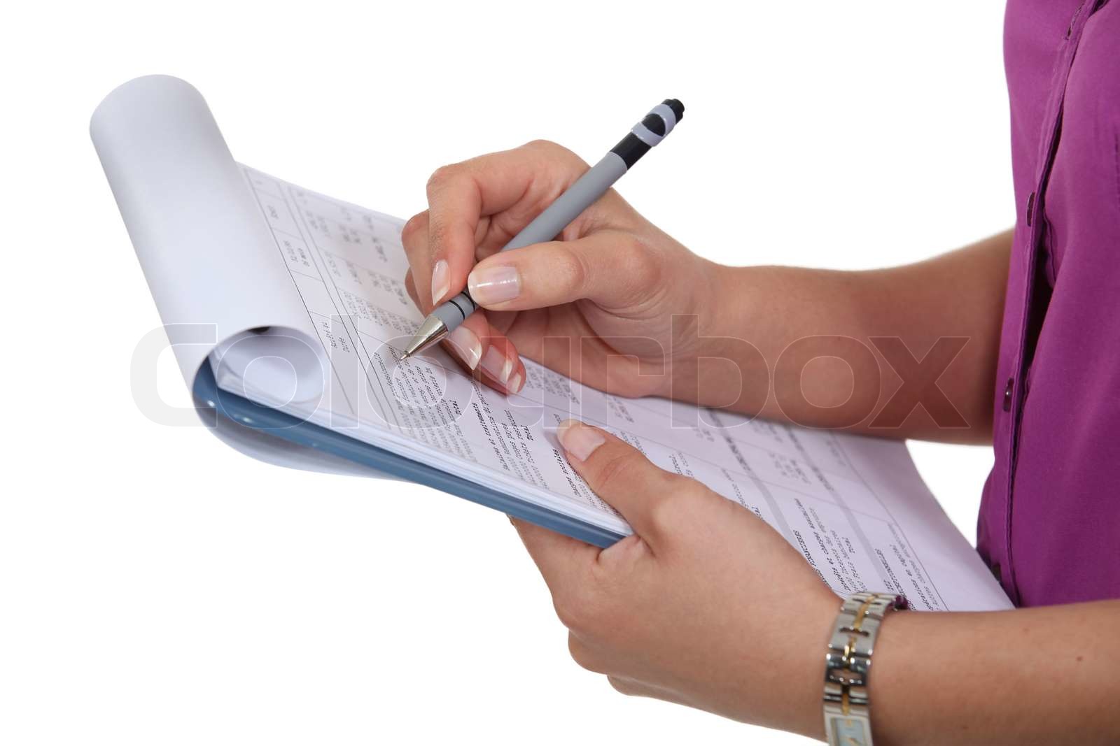 Woman filling in a form | Stock image | Colourbox