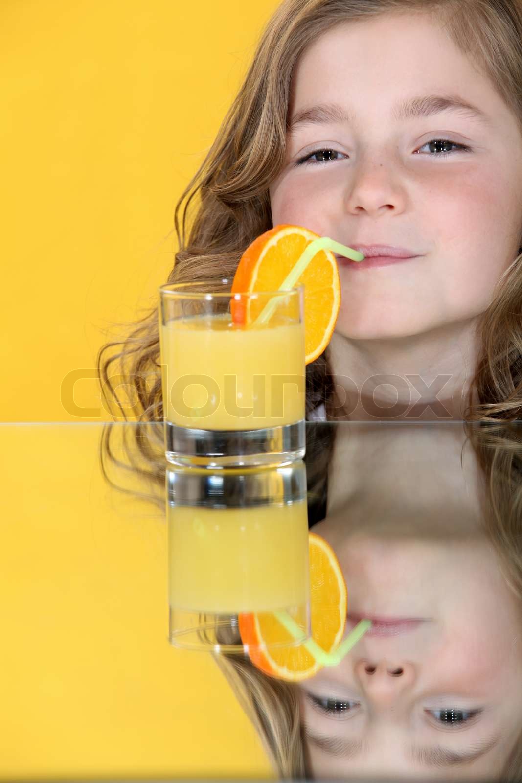 Girl drinking juice | Stock image | Colourbox