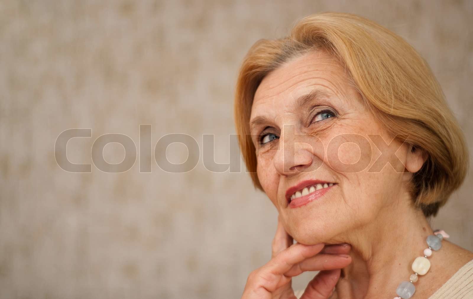 Magnificent old lady is resting at home | Stock image | Colourbox