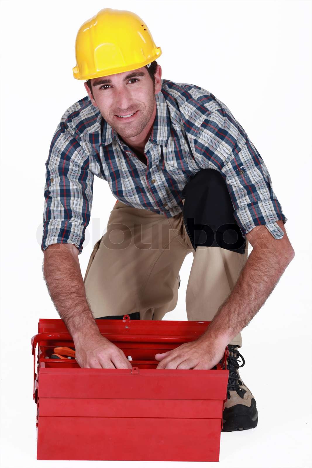 Ein Handwerker sucht mit seinem Werkzeugkasten | Stock Bild | Colourbox