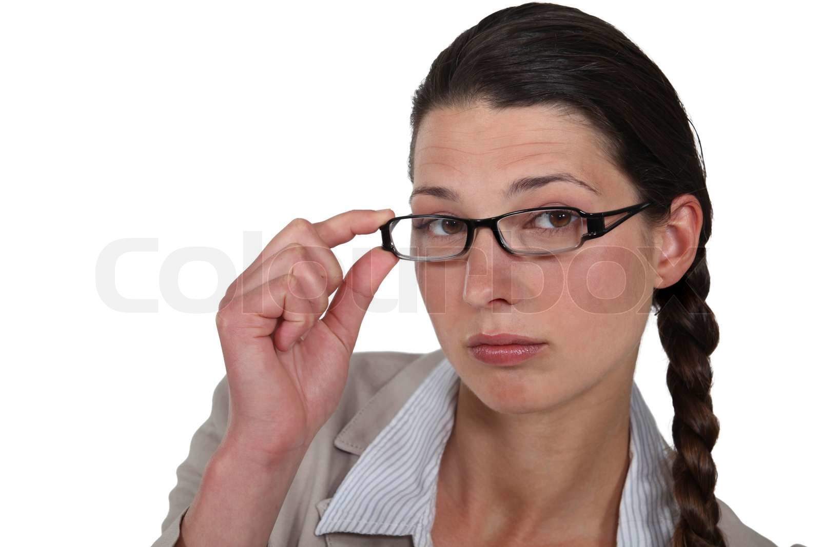 Woman adjusting her glasses | Stock image | Colourbox