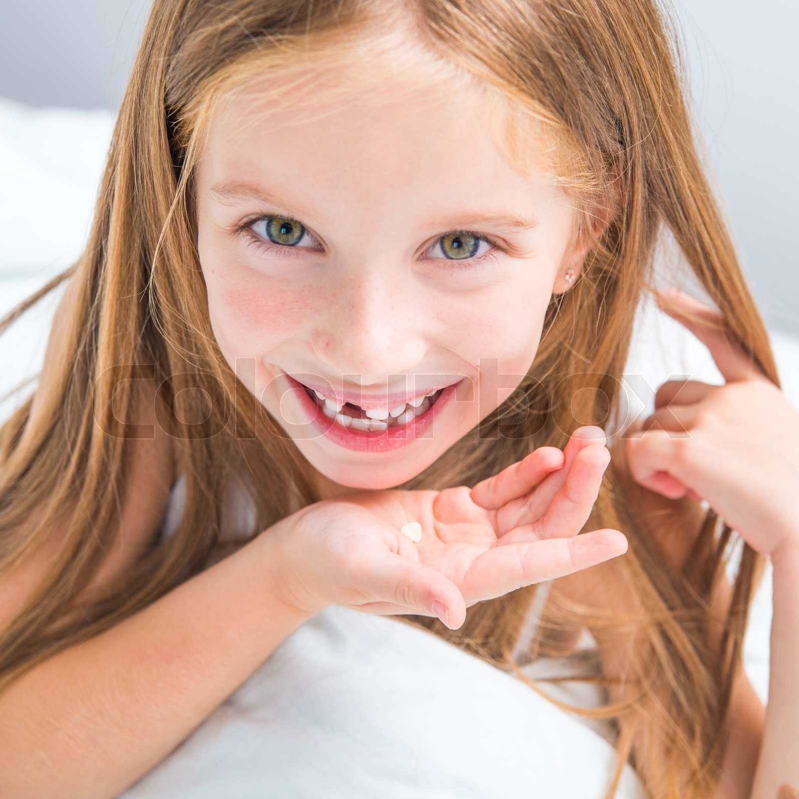 girl showing her teeth | Stock image | Colourbox