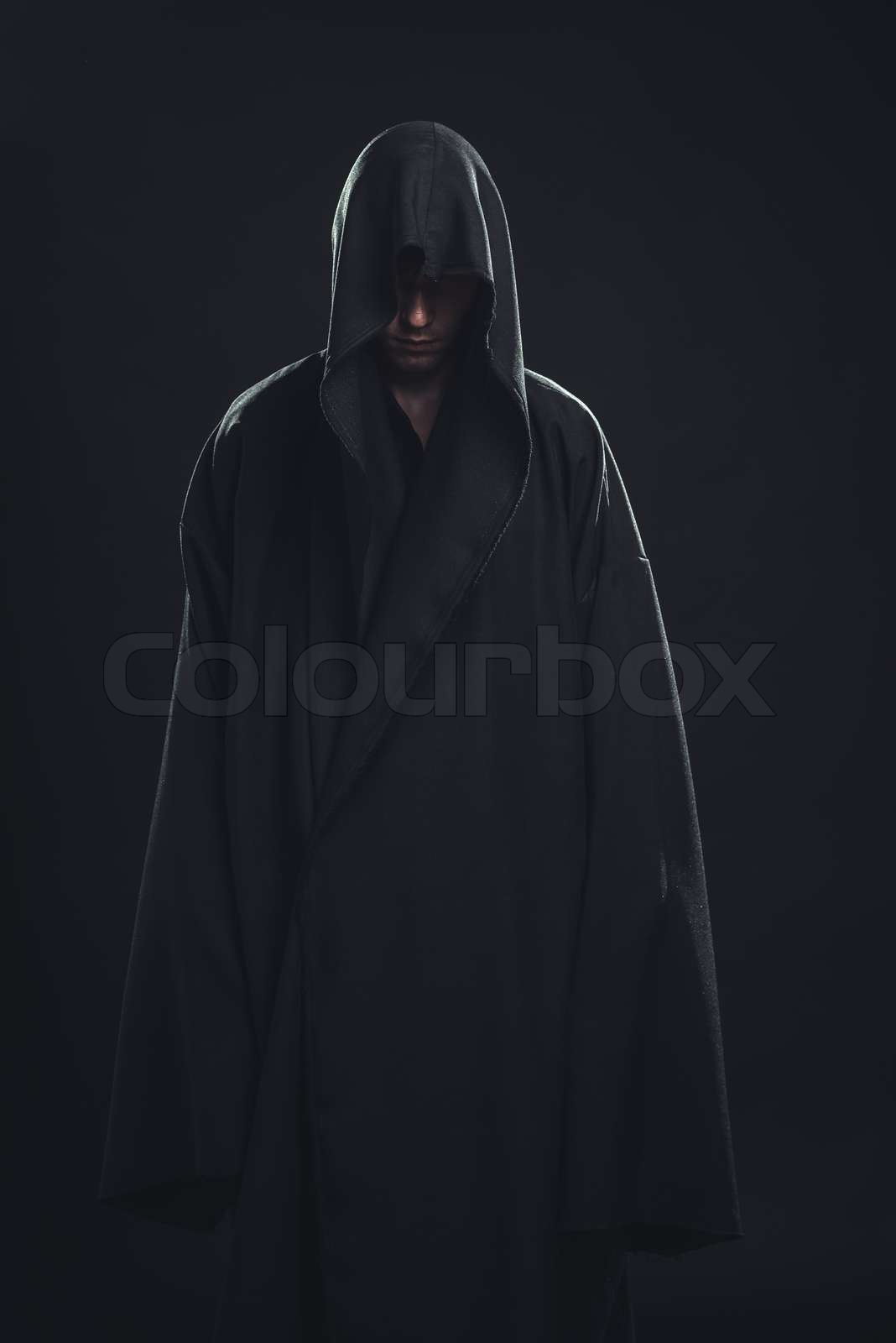 Portrait of man in a black robe | Stock image | Colourbox