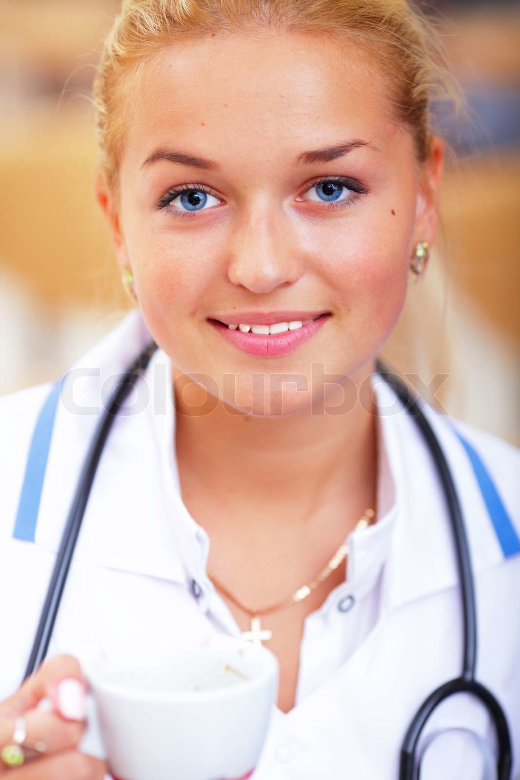 Closeup portrait of young attractive nurse | Stock image | Colourbox