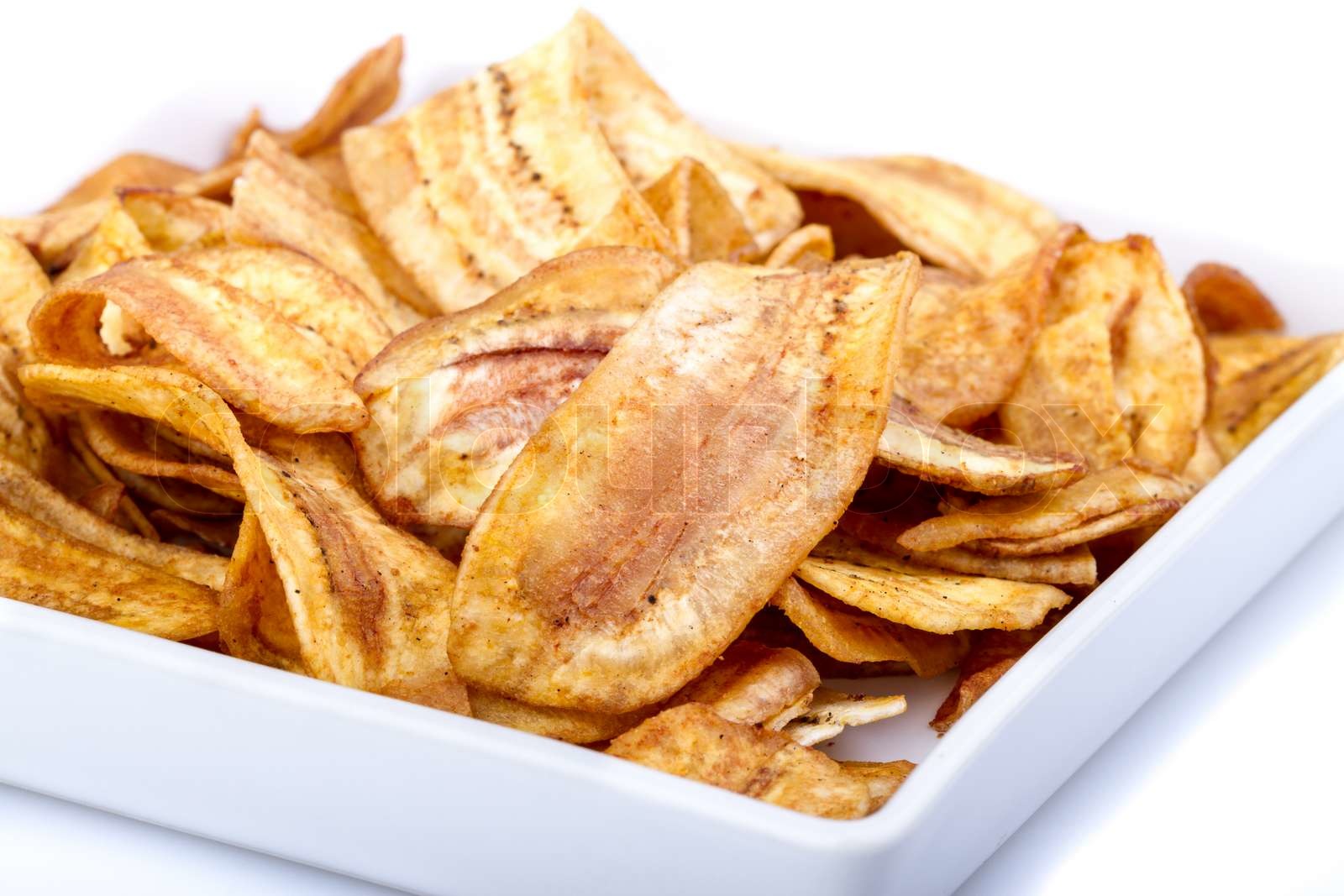 Knusprige Bananen Chips auf weißem Teller | Stock Bild | Colourbox
