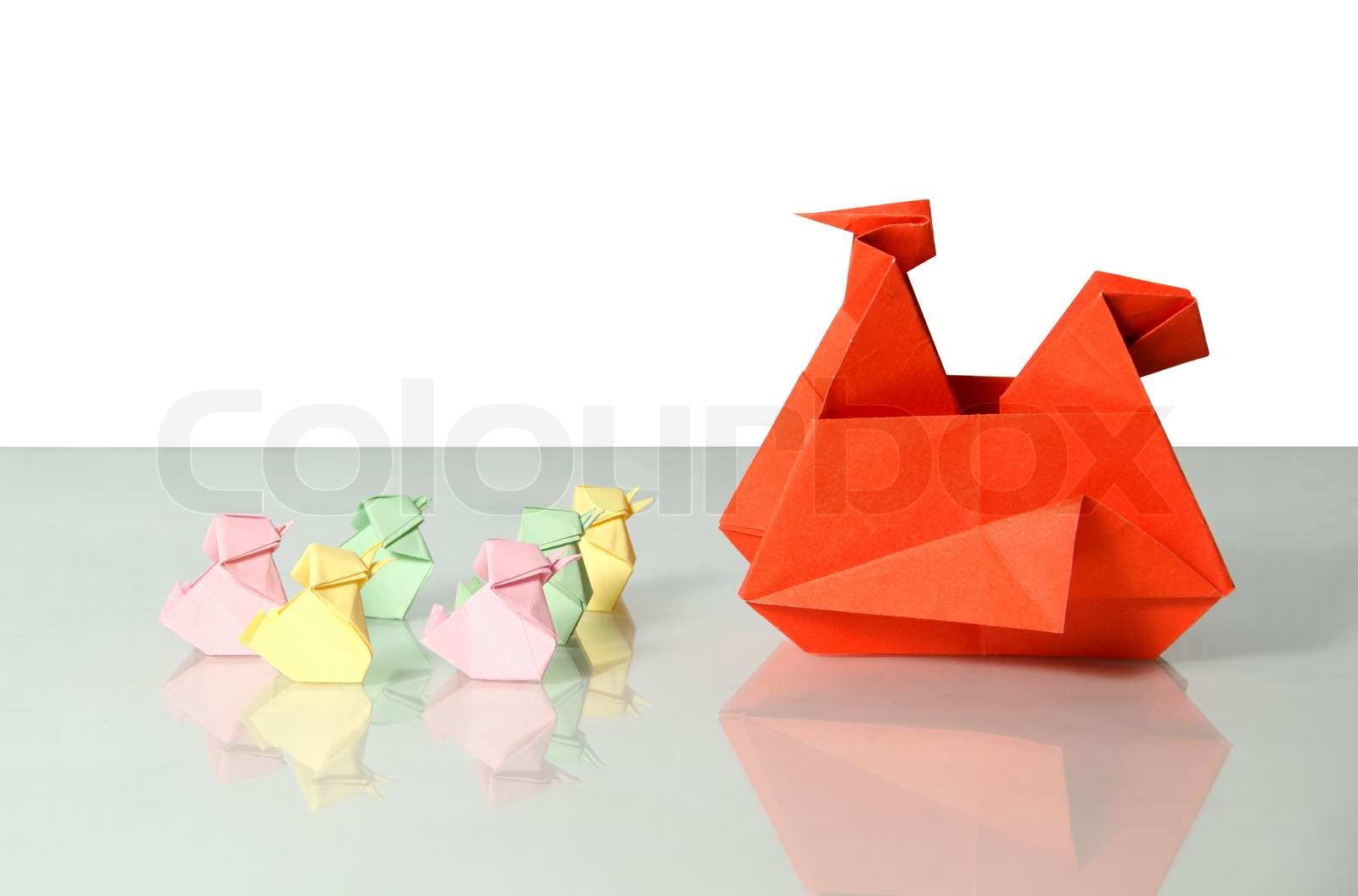 origami hen and chicken from paper on white background | Stock image ...