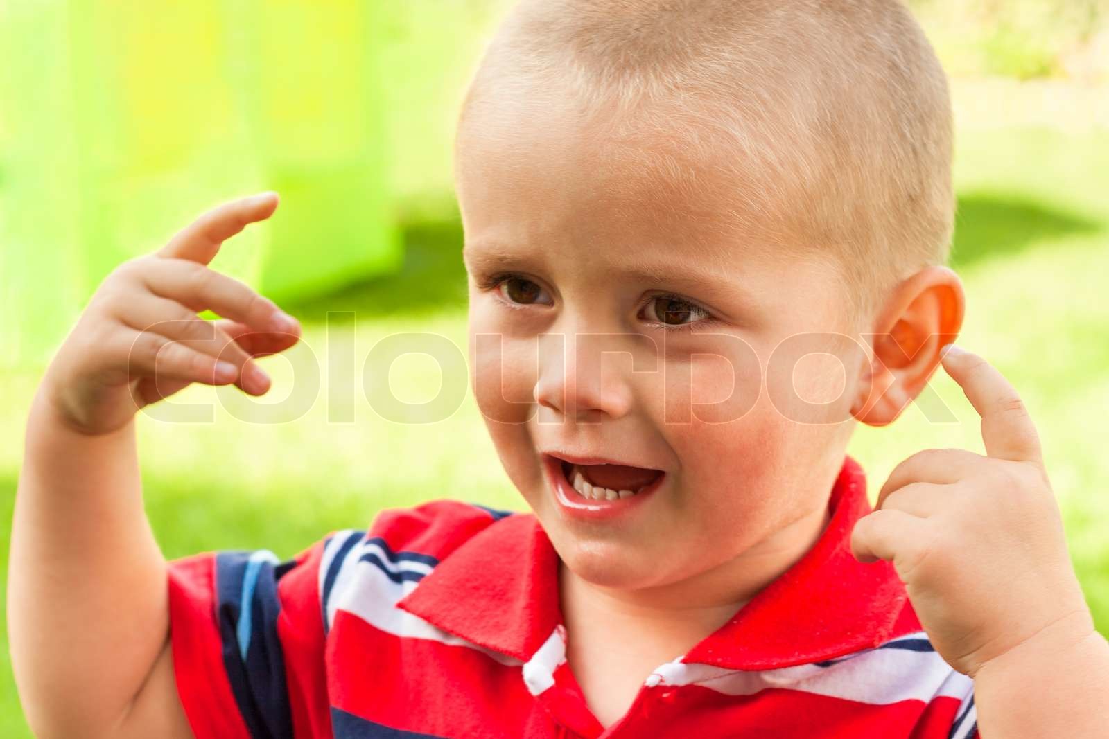 Child shouting and gesturing | Stock image | Colourbox