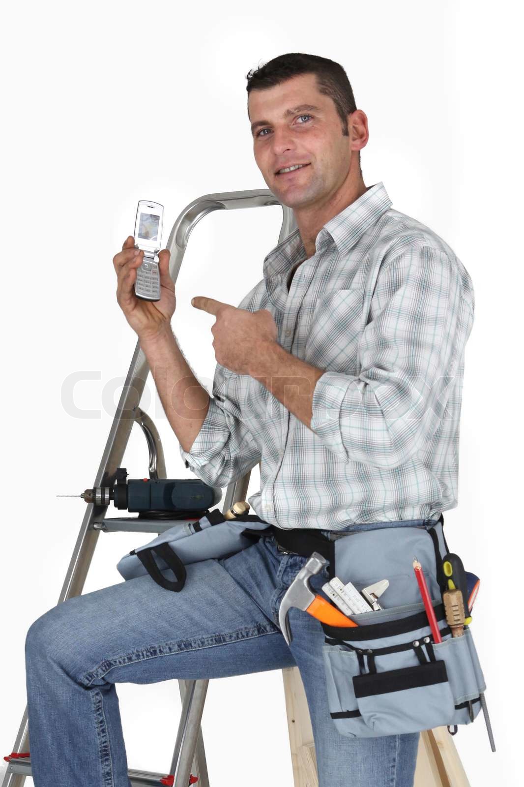 craftsman pointing at his cell | Stock image | Colourbox