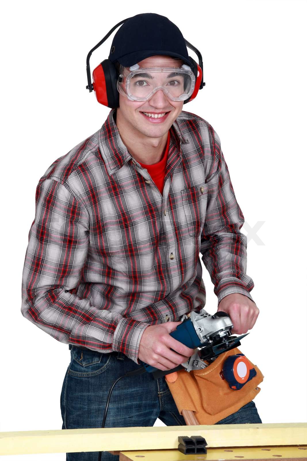 Man holding a power tool | Stock image | Colourbox